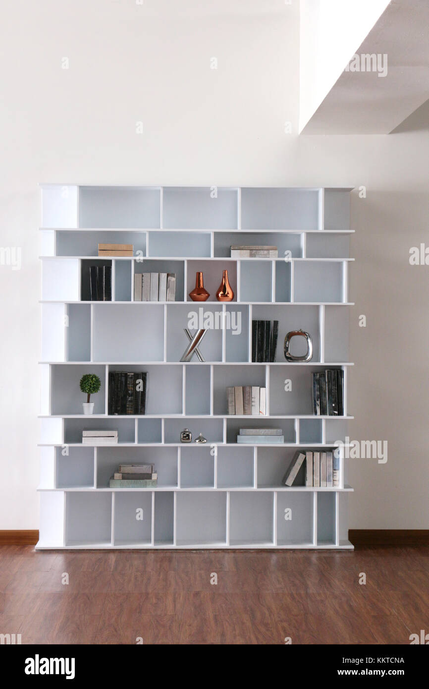a modern design book shelf in the living room Stock Photo - Alamy