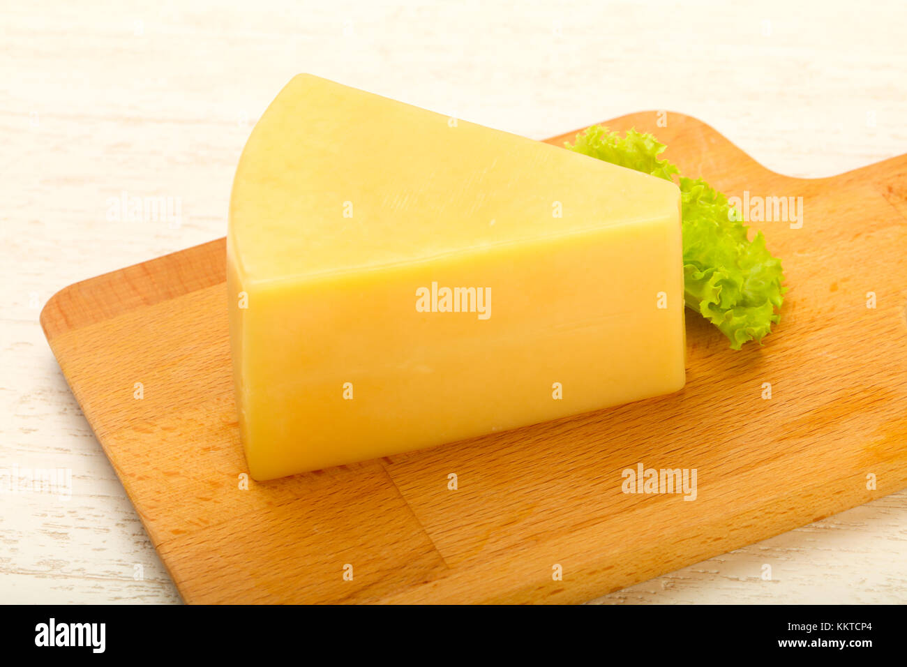 Parmesan cheese triangle Stock Photo - Alamy