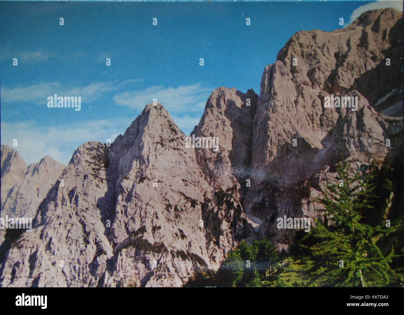 This postcard, dating from 1966, depicts the Julian Alps, a mountain ...