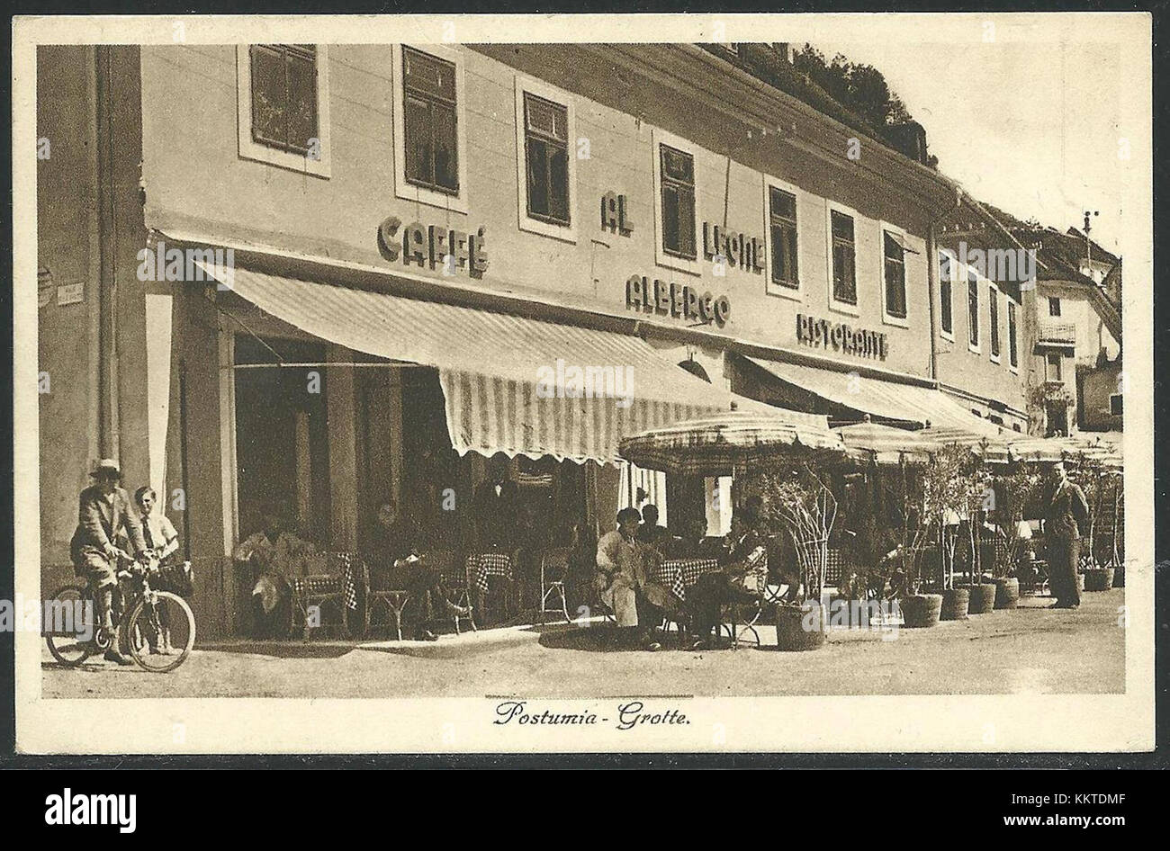 This 1935 postcard of Postojna, Slovenia, features the town's notable ...