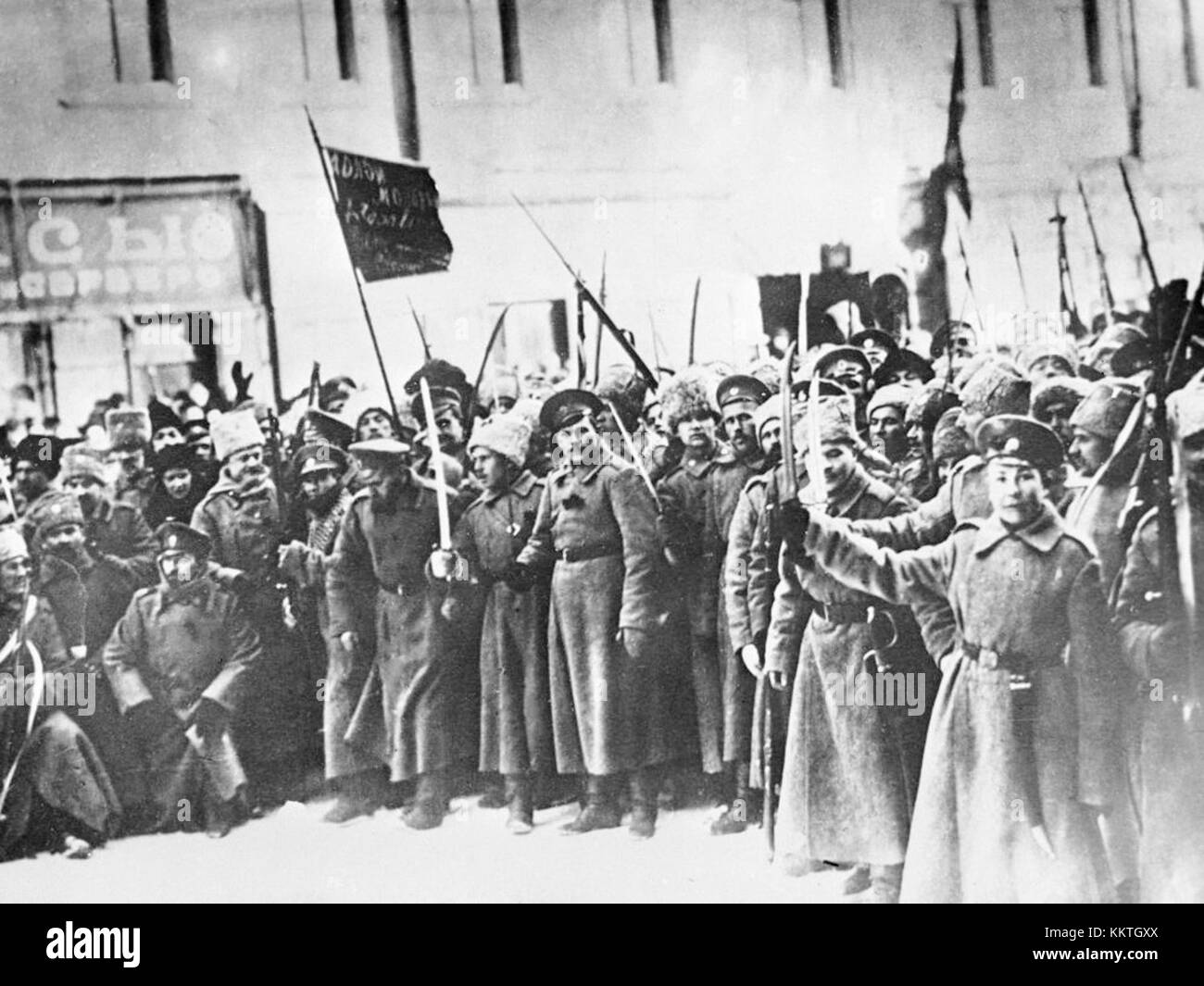 A 1917 postcard featuring a sign advertising gold and silver watches ...