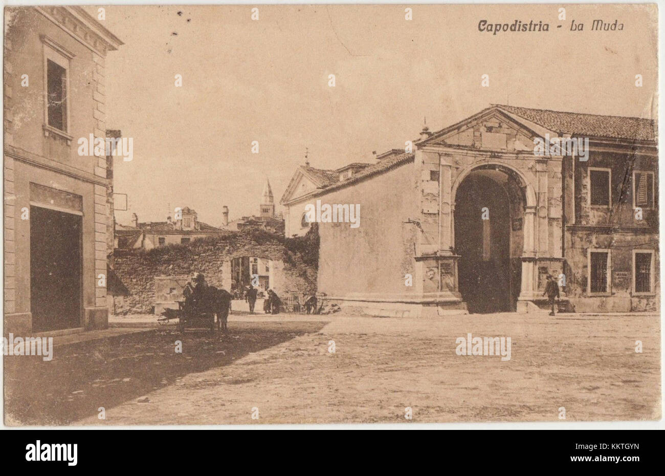 A historical postcard from 1920 featuring the Koper Muda Gate, a ...