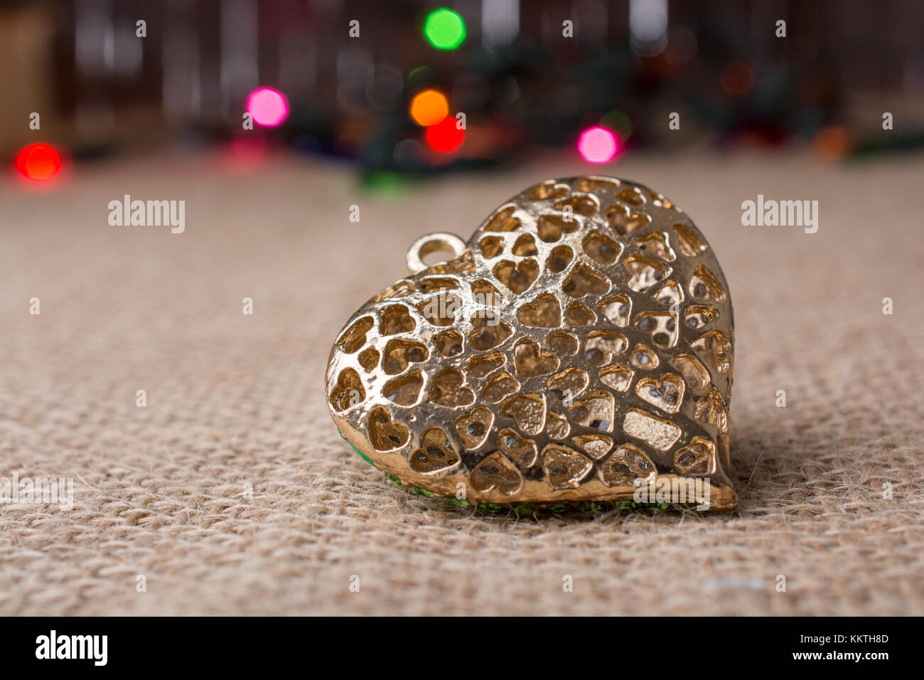Christmas lights behind heart shaped object Stock Photo - Alamy