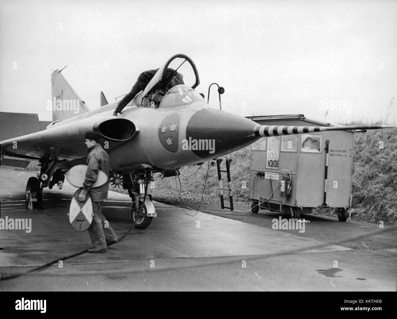 An air force soldier stands in front of a fighter plane at the Air ...