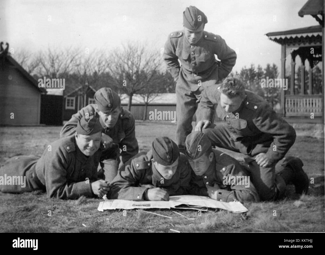 An image of Danish soldiers reading a newspaper during the year 1940 ...