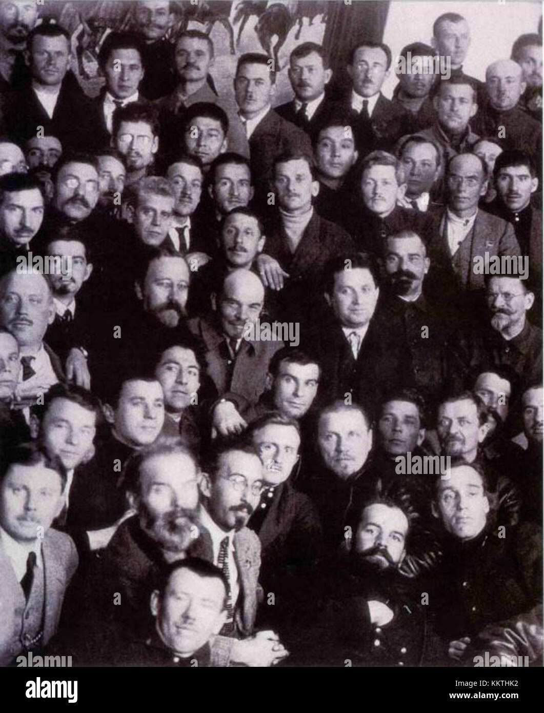 This historical image depicts prominent Soviet figures: Lenin, Zinoviev ...