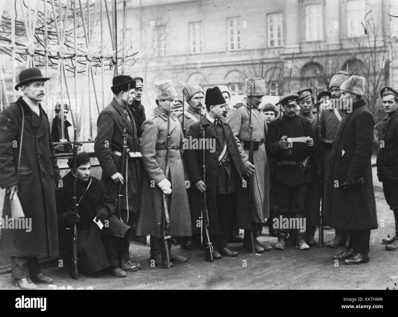 This image captures a scene at the gates of the Smolny Institute, an ...