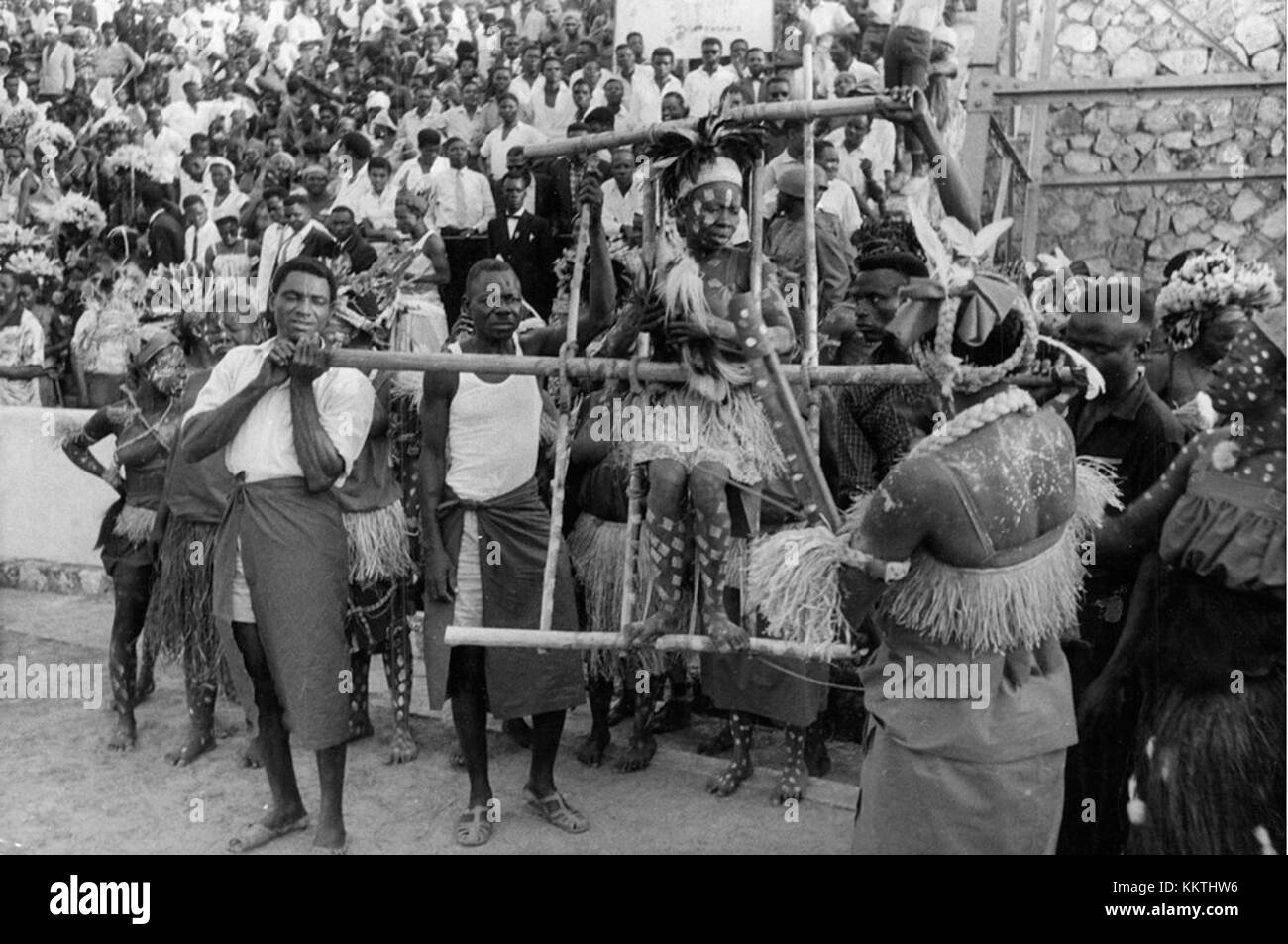 This historical photograph depicts a native woman seated in a bamboo ...
