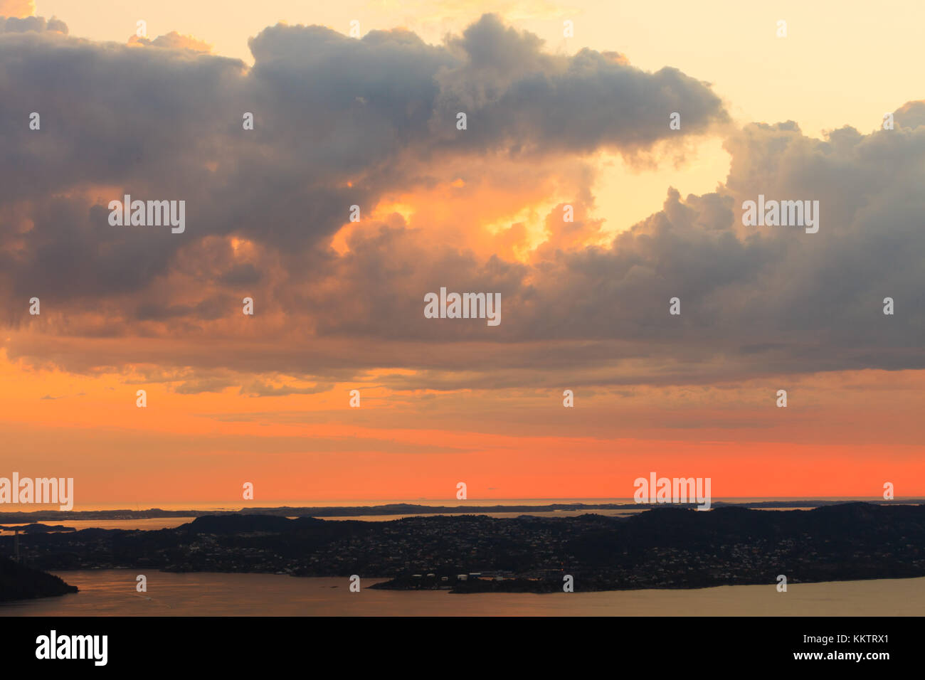 Panoramic view from hill of Bergen and fjord landscape red sky sunset ...