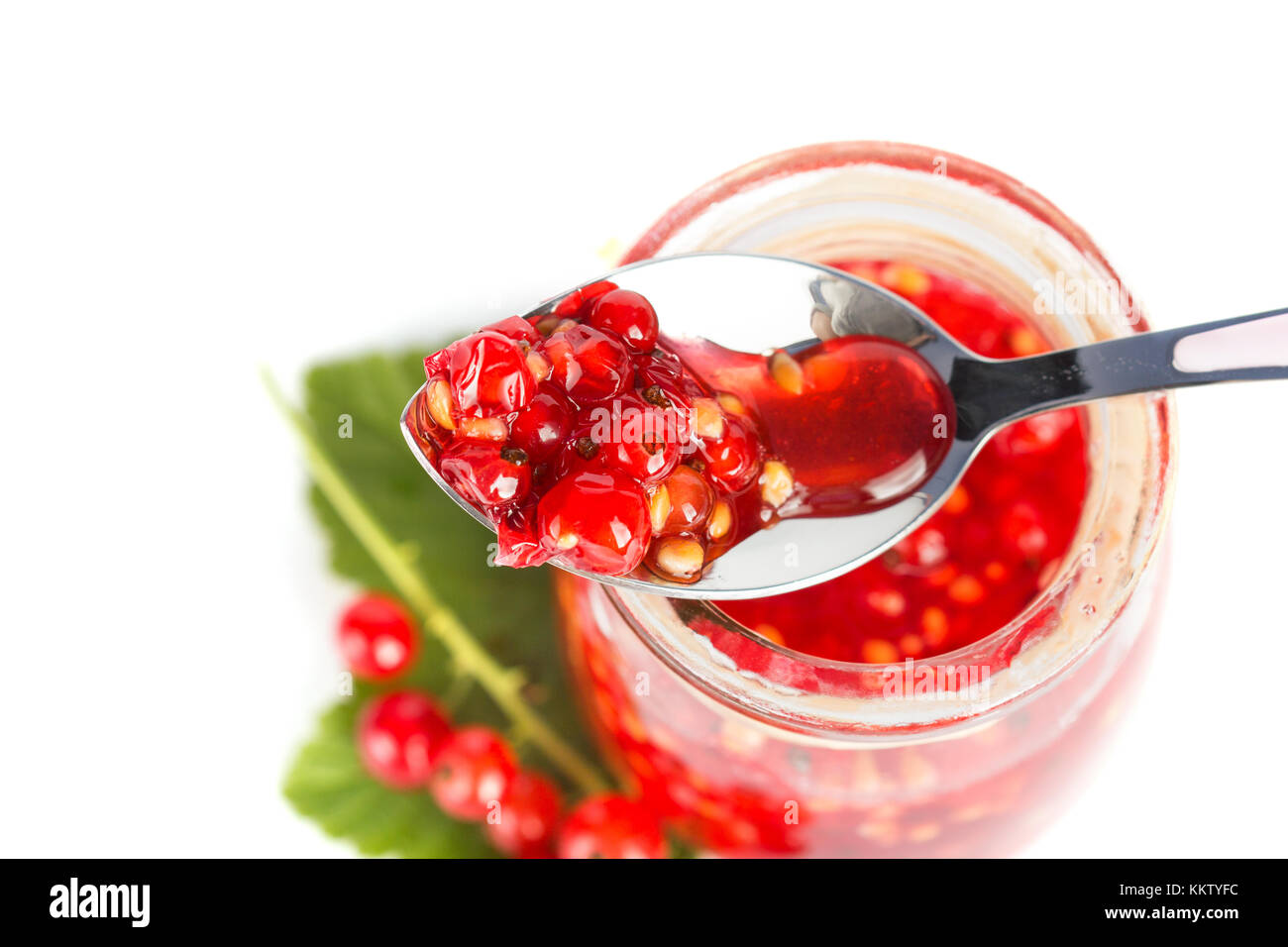 Red current homemade jam on a white background Stock Photo - Alamy