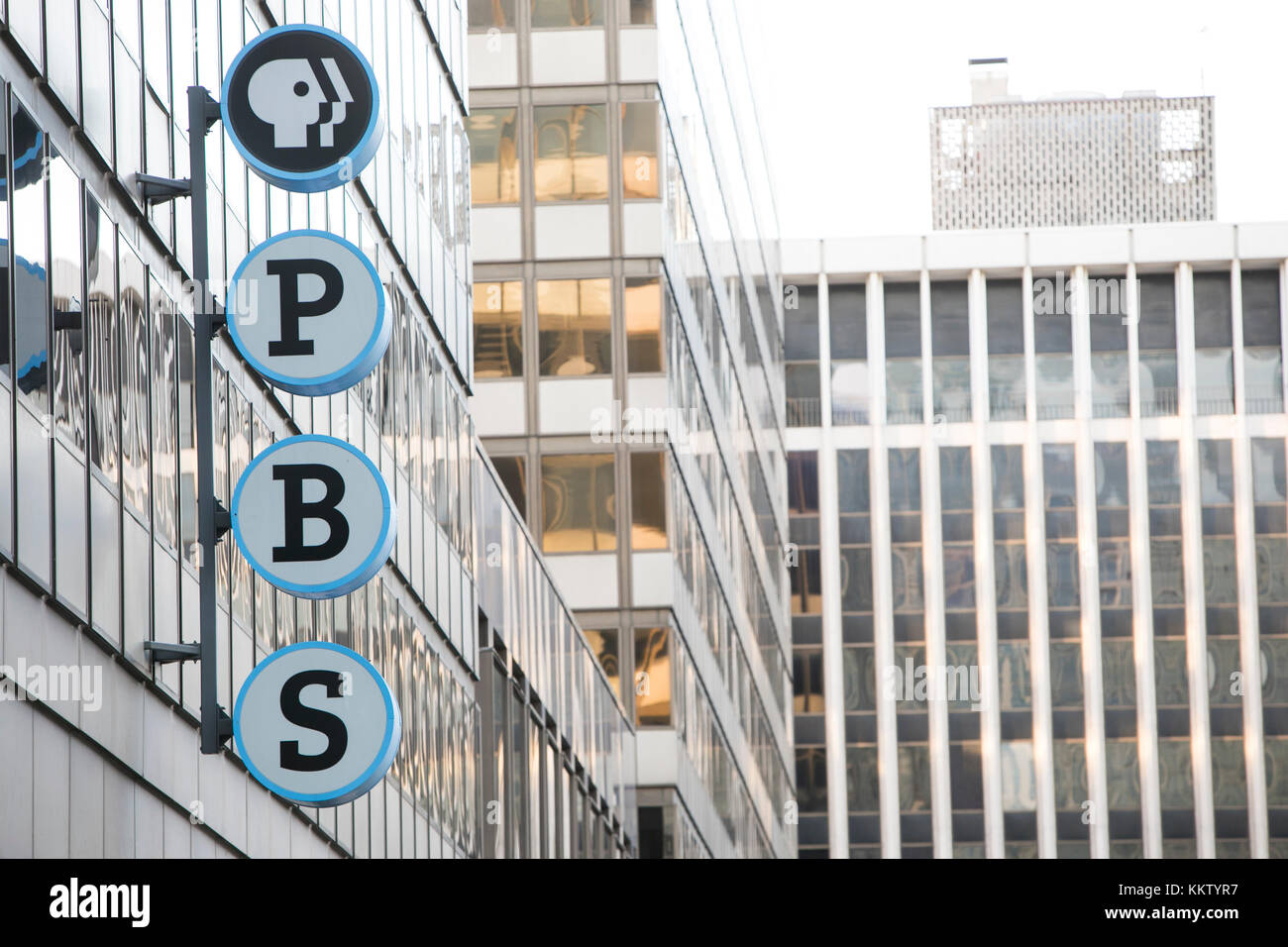 A logo sign outside of the headquarters of The Public Broadcasting ...