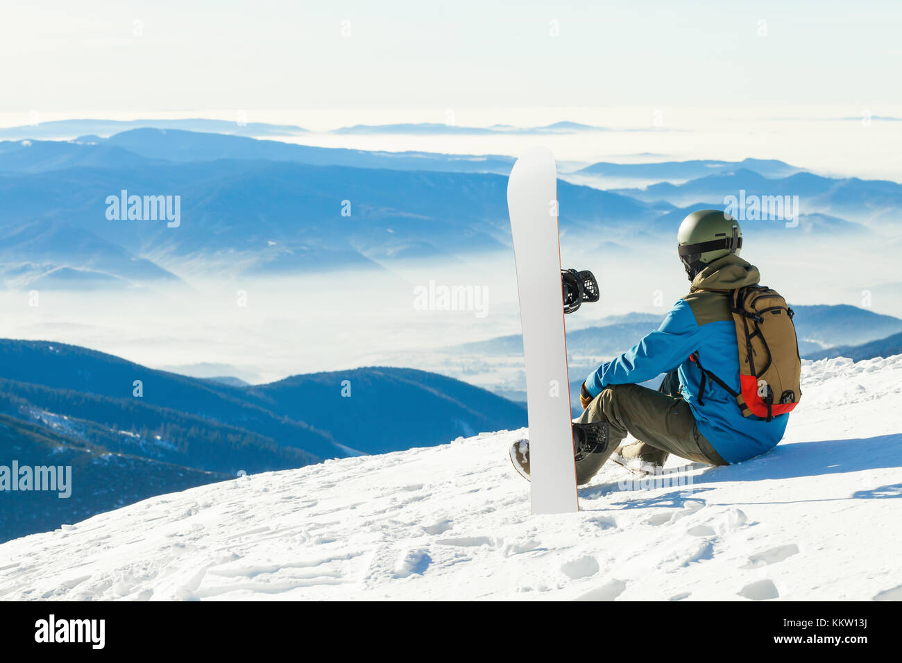 Snowboarder looking at a beautiful scenery before him Stock Photo - Alamy