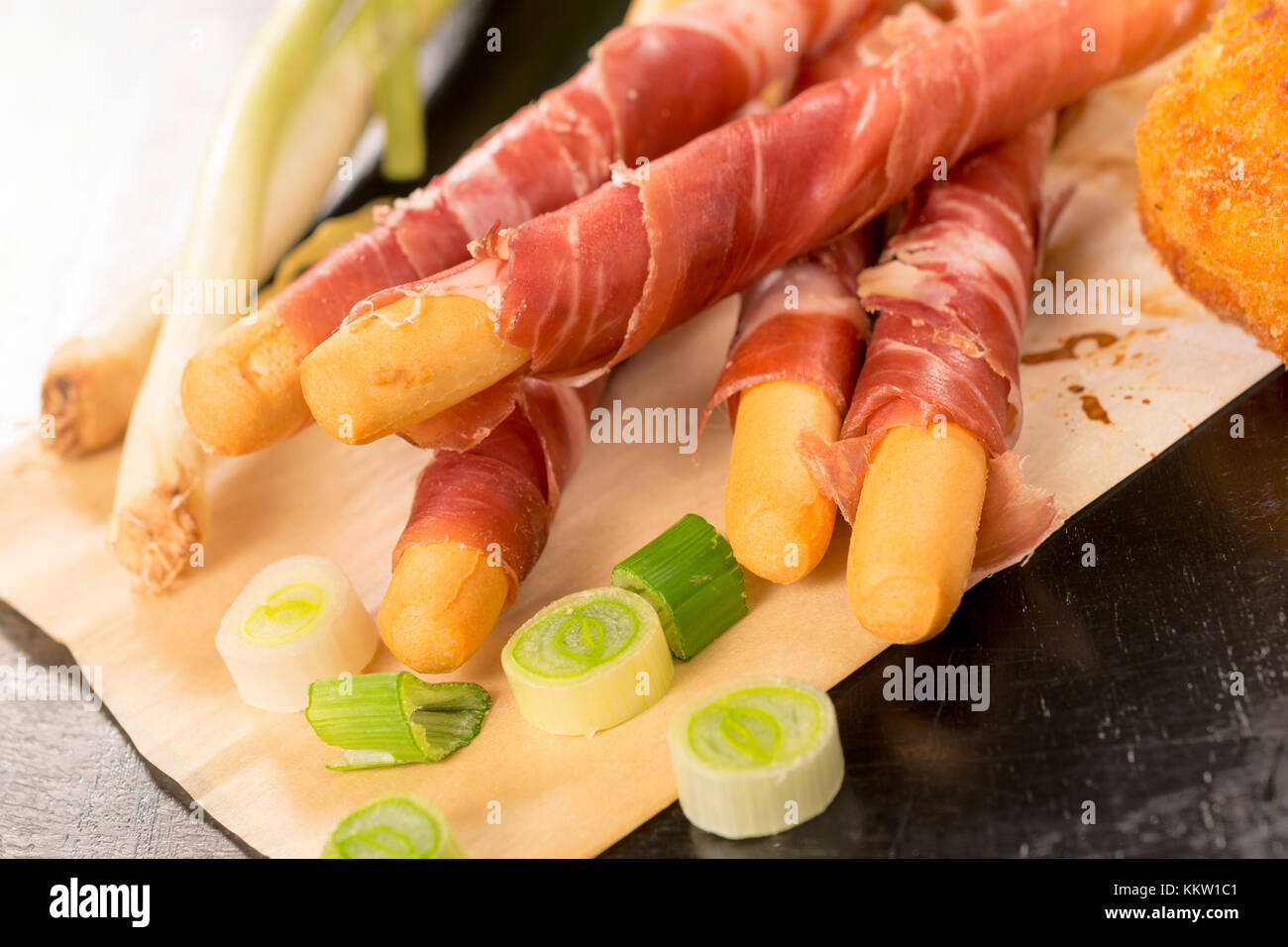 Salted sticks with prosciutto.Selective focus on the front stick Stock ...
