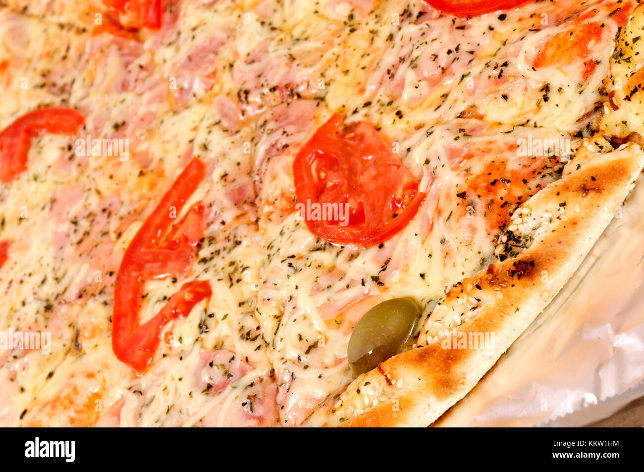 Selective focus on the front side of pizza slice Stock Photo - Alamy