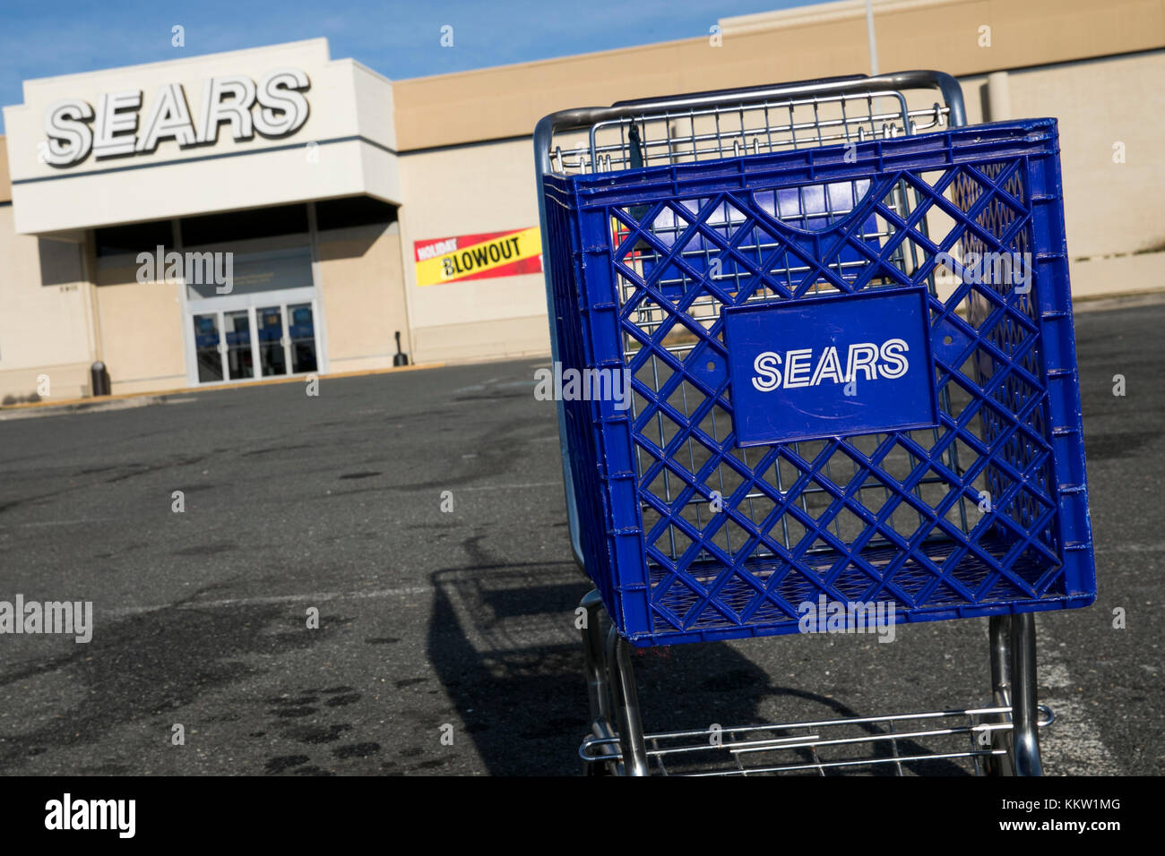 A logo sign outside of a Sears retail store in Alexandria, Virginia on ...