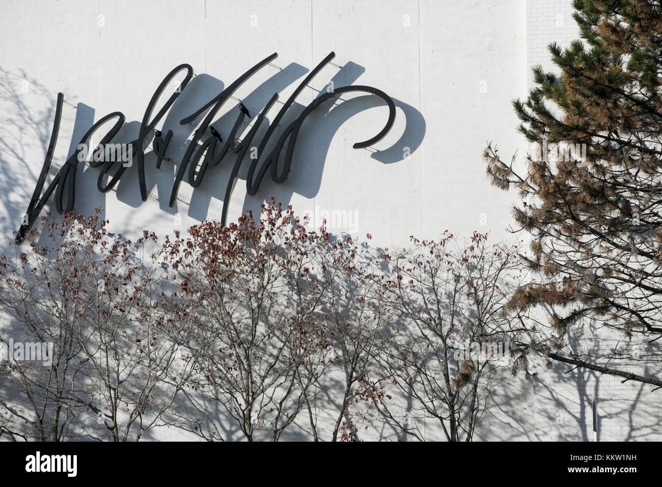 A logo sign outside of a Lord & Taylor retail store in Fairfax ...