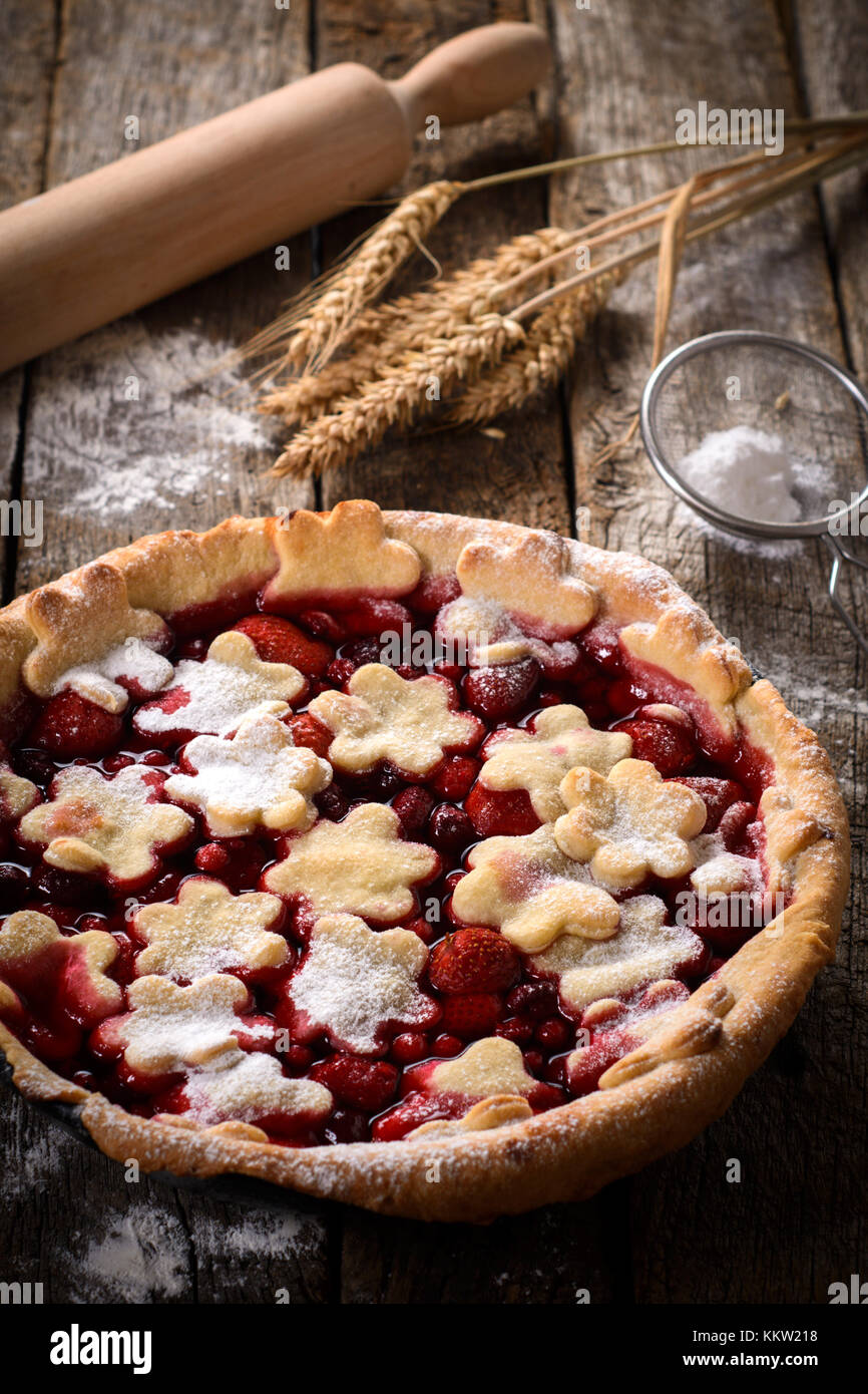Sweet fruit pie in the pan on woden background,selective focus Stock ...