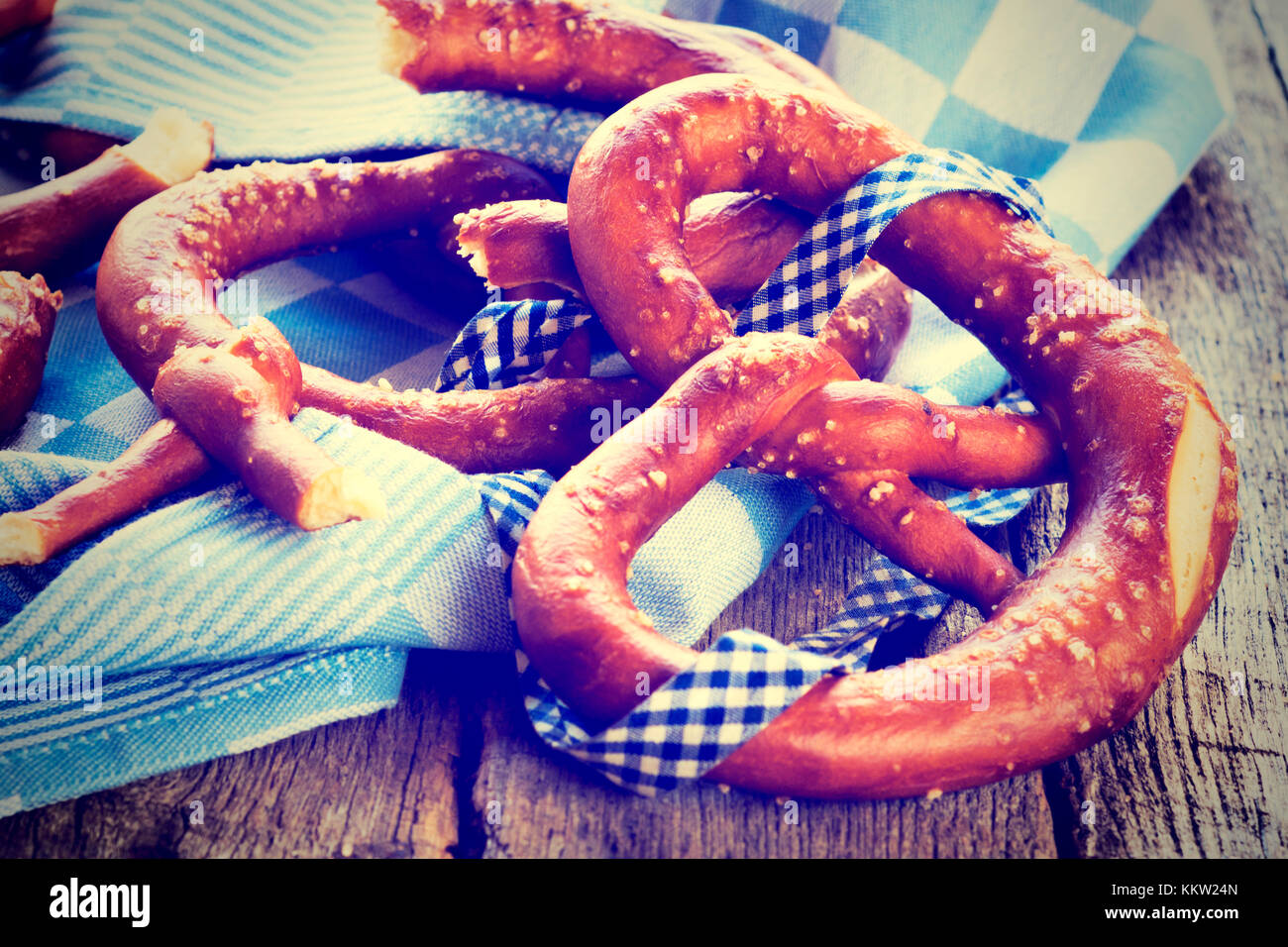 Traditional German pretzels on the wooden background.Selective focus in ...