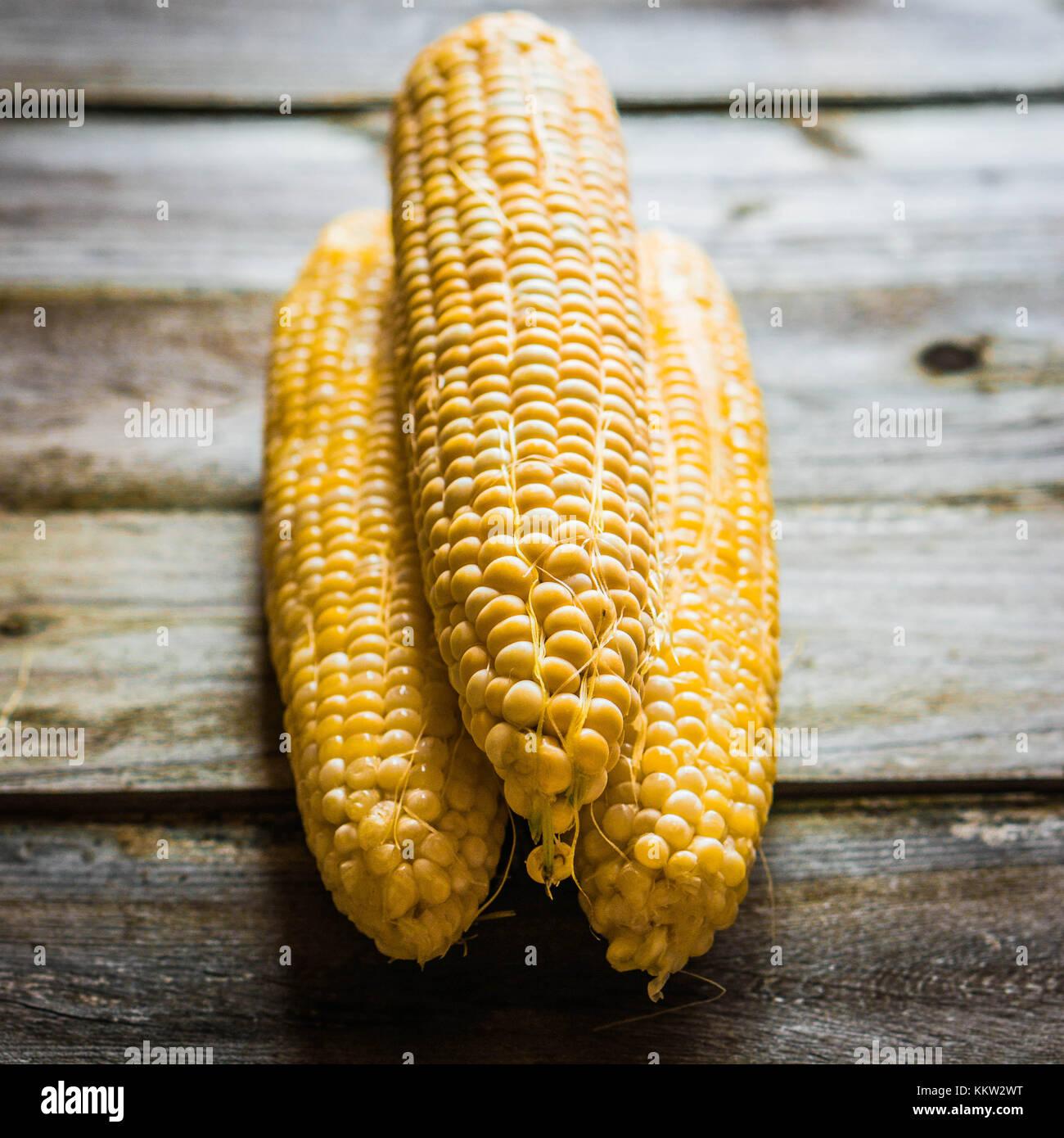 Sweet Corn On Rustic Background Stock Photo - Alamy
