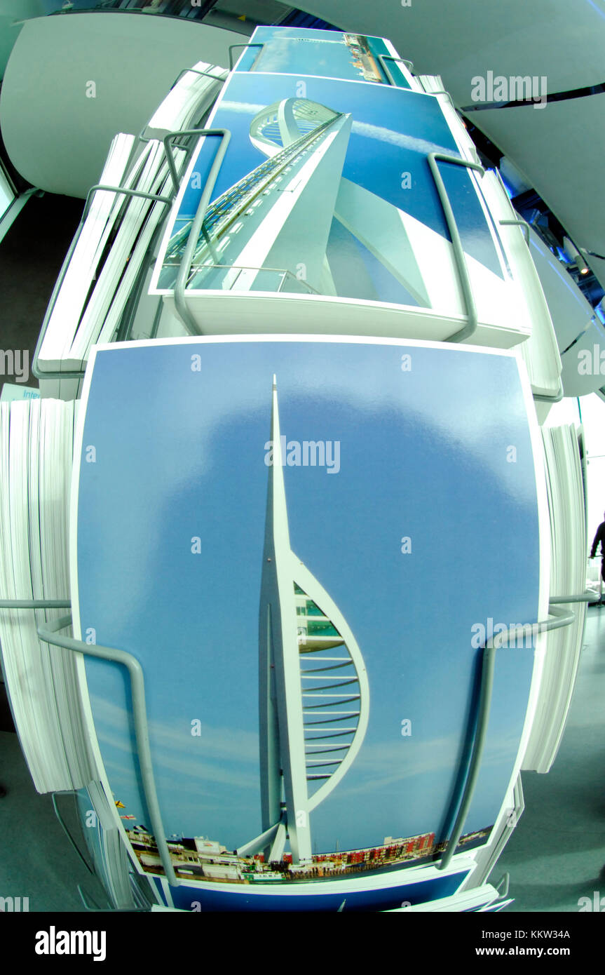 A very unusual view of some postcards of the spinnaker tower on a rack ...