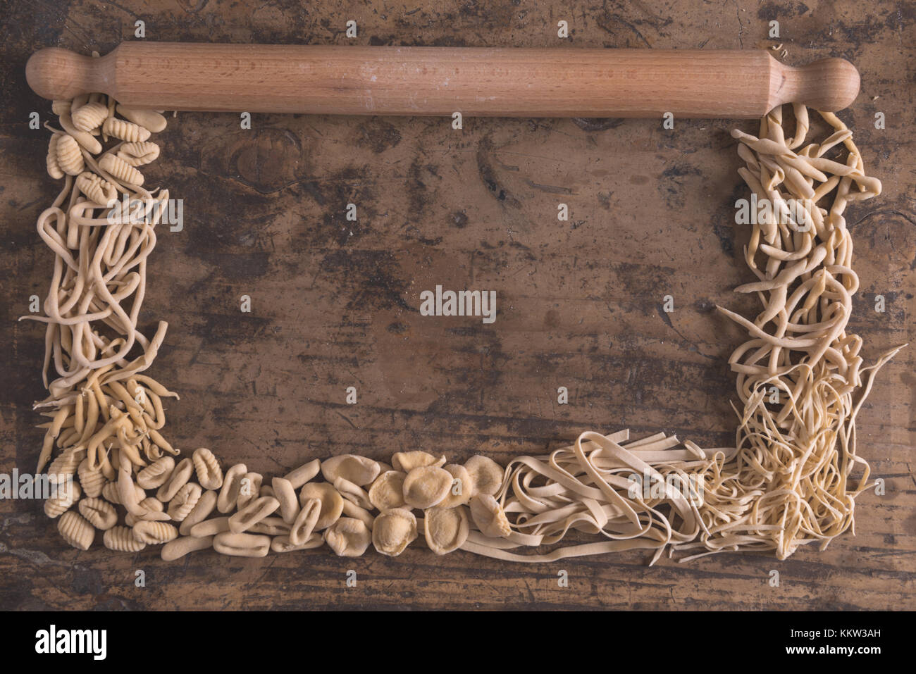 Mixed fresh italian pasta on wood table in frame composition Stock ...