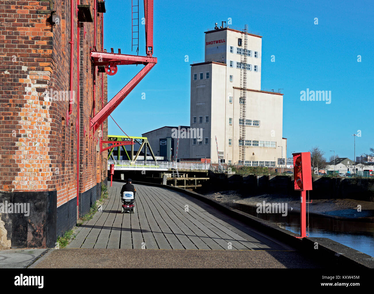 Man on mobility scooter on boardwalk, Museum Quarter, Hull, Humberside ...