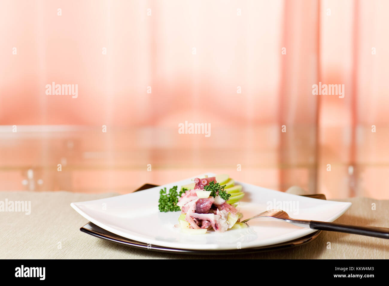 delicious octopus tartare with green appel and parsley Stock Photo - Alamy