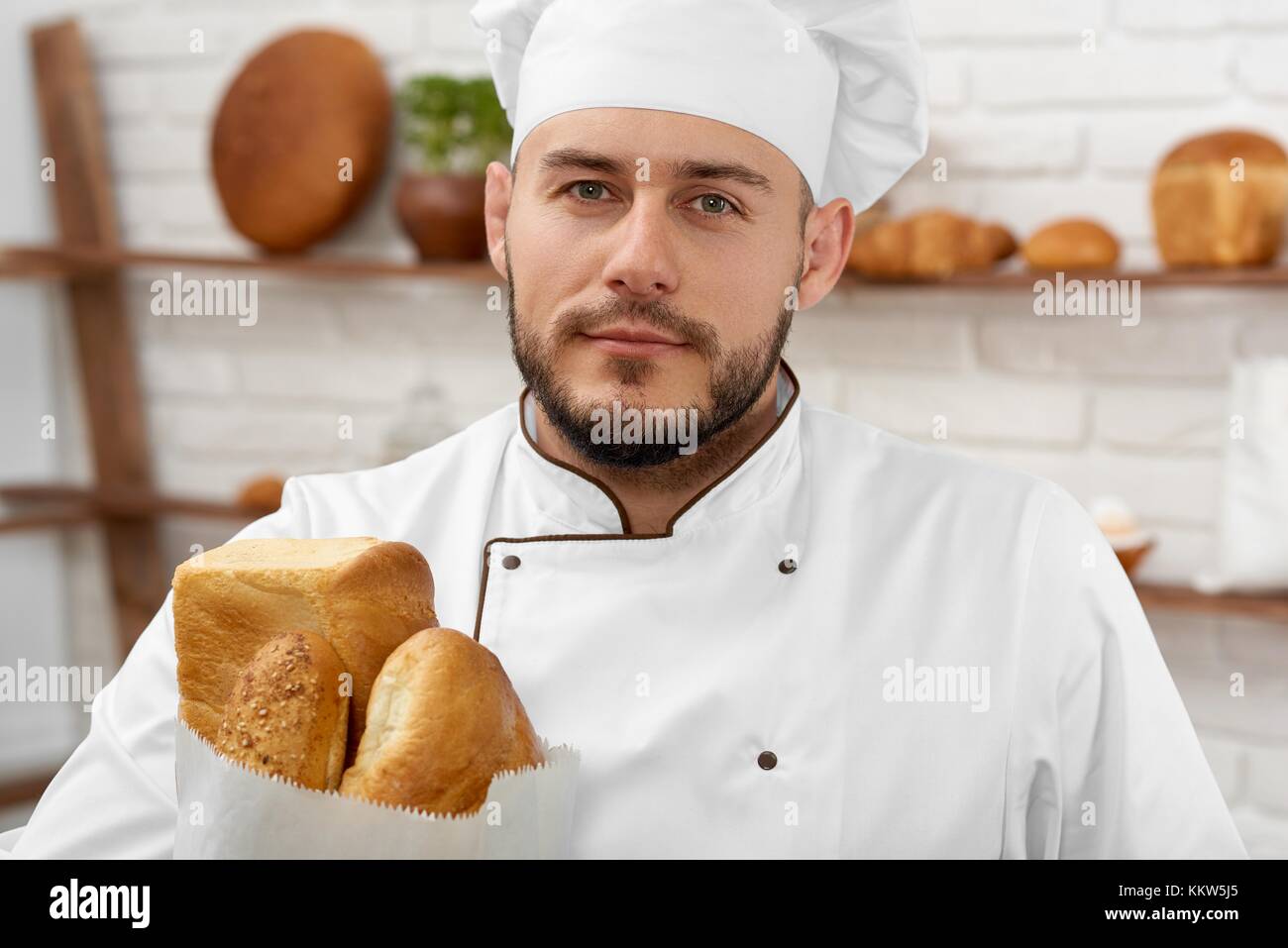 Young man working at his bakery Stock Photo - Alamy