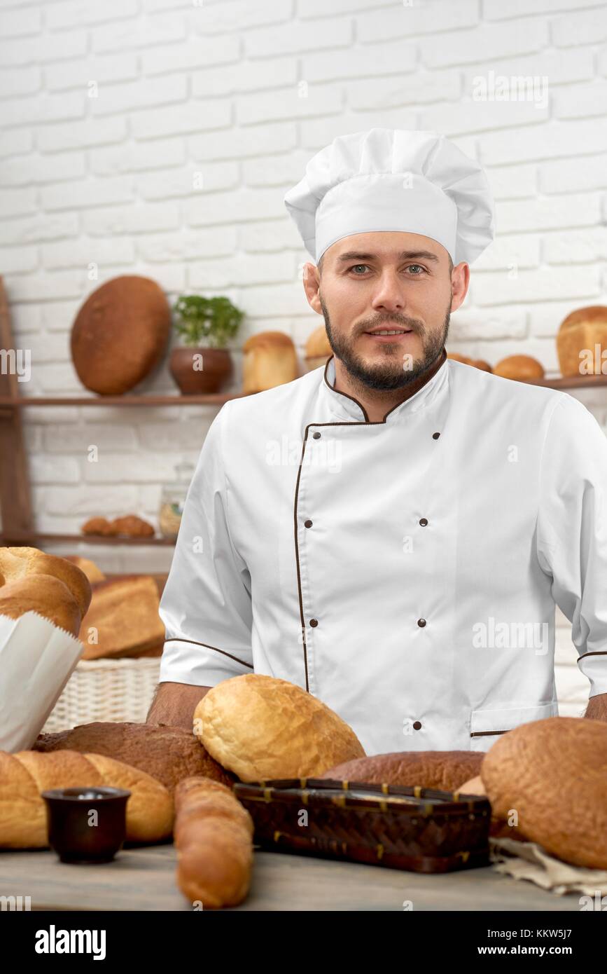 Young man working at his bakery Stock Photo - Alamy