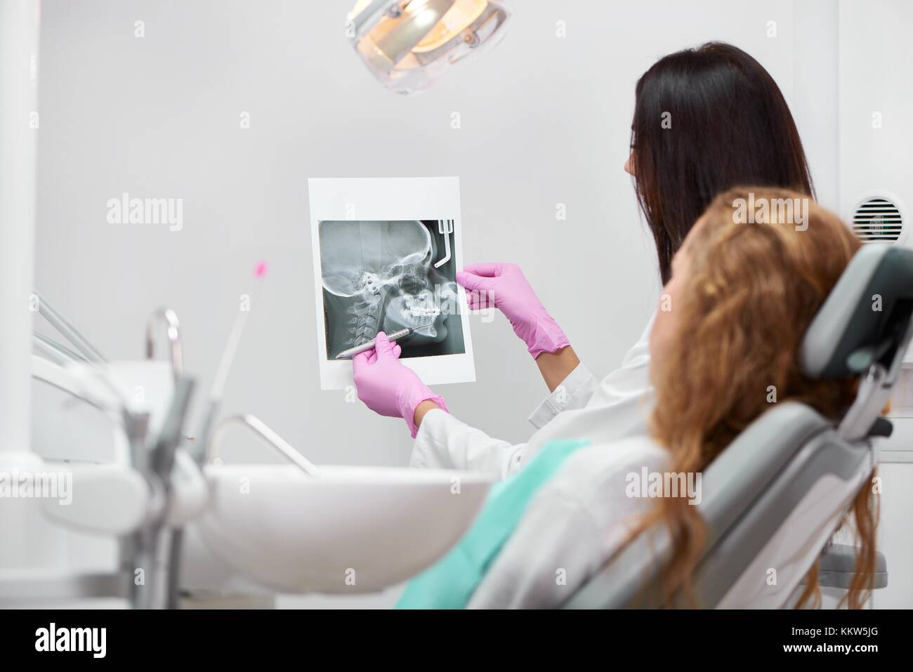 Professional female dentist at work Stock Photo - Alamy