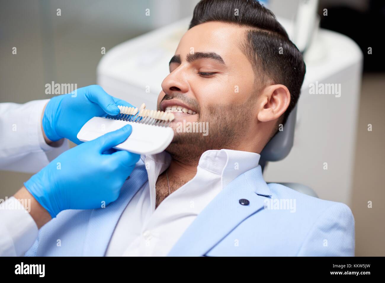 Young man visiting dentist Stock Photo - Alamy