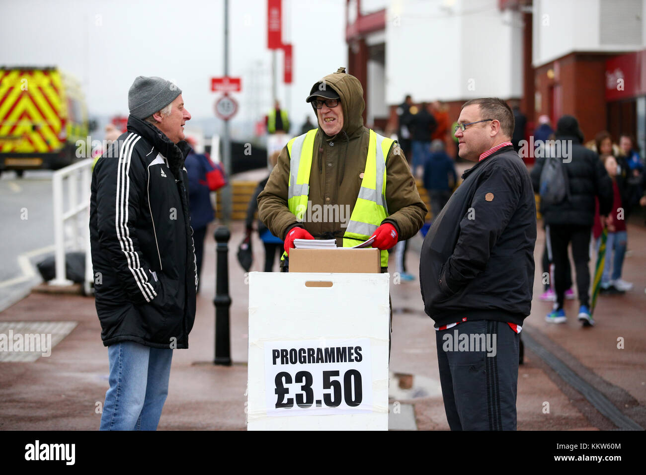 A vendor sells match day programmes during the Premier League match at ...