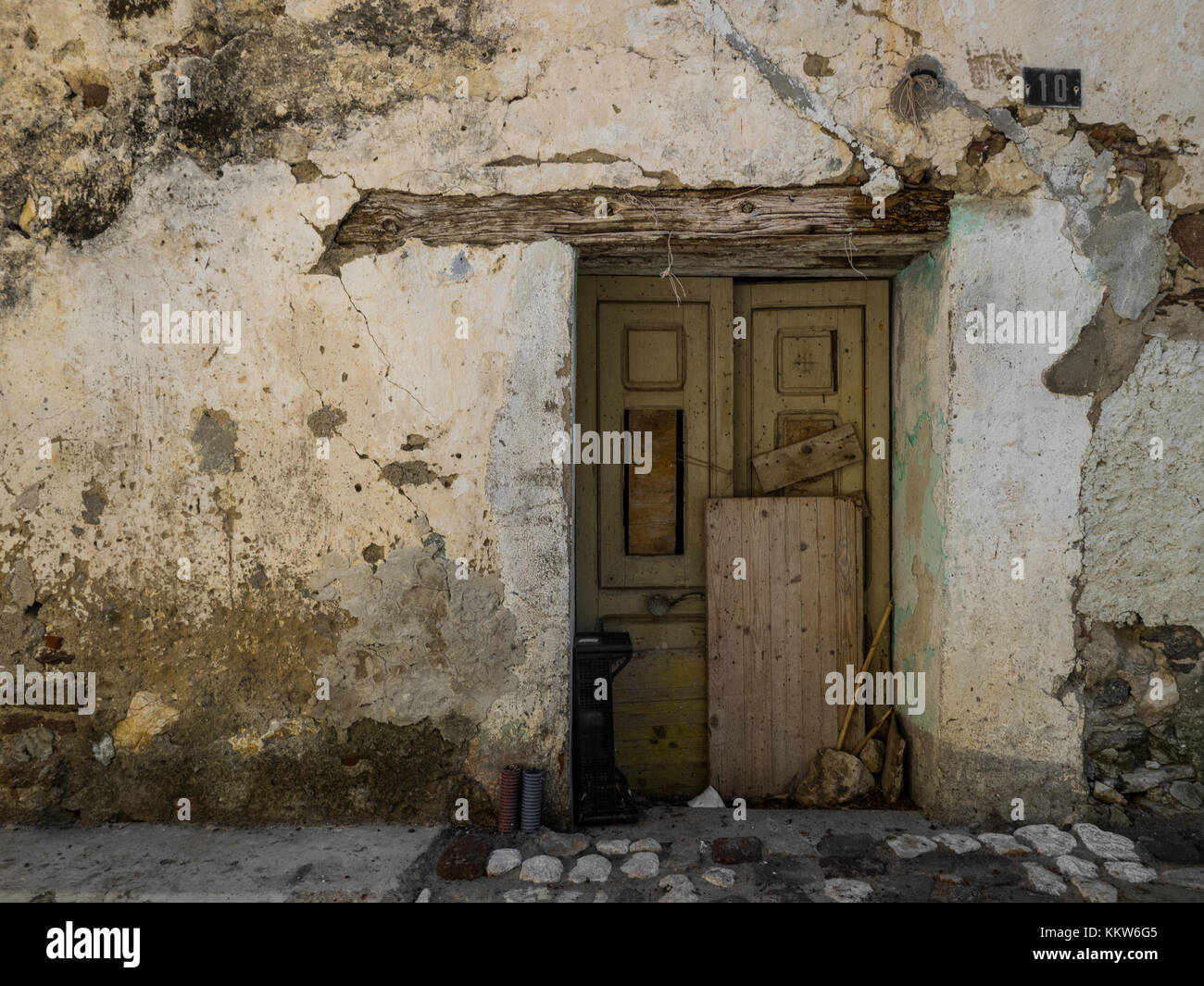 old door with decayed wall in italy Stock Photo - Alamy