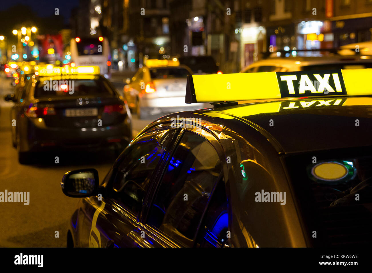 Taxi service in the city in the night Stock Photo - Alamy