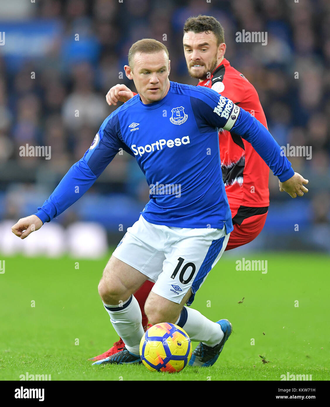 Everton's Wayne Rooney (left) and Huddersfield Town's Scott Malone in ...