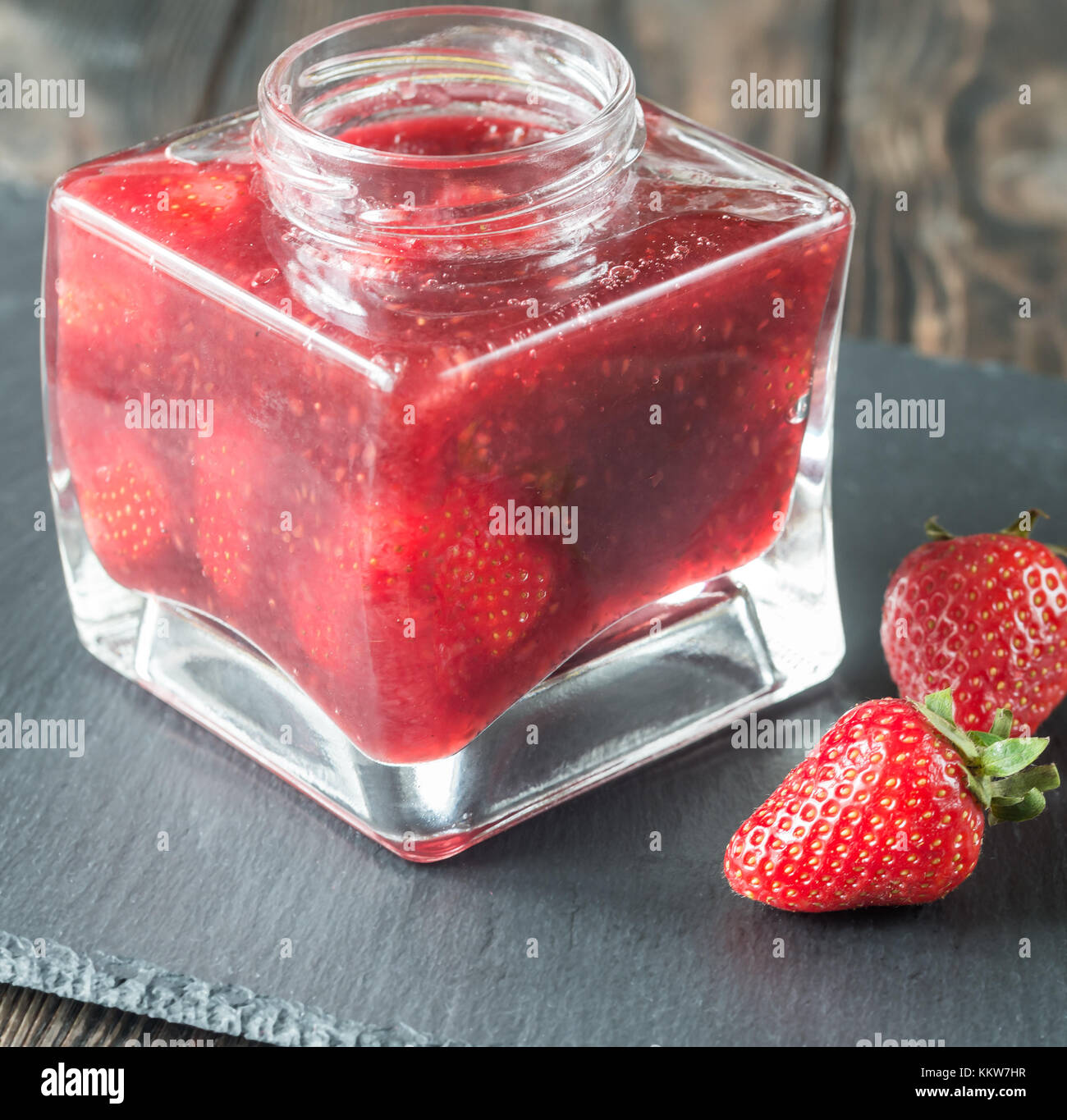 Glass jar of strawberry jam Stock Photo - Alamy