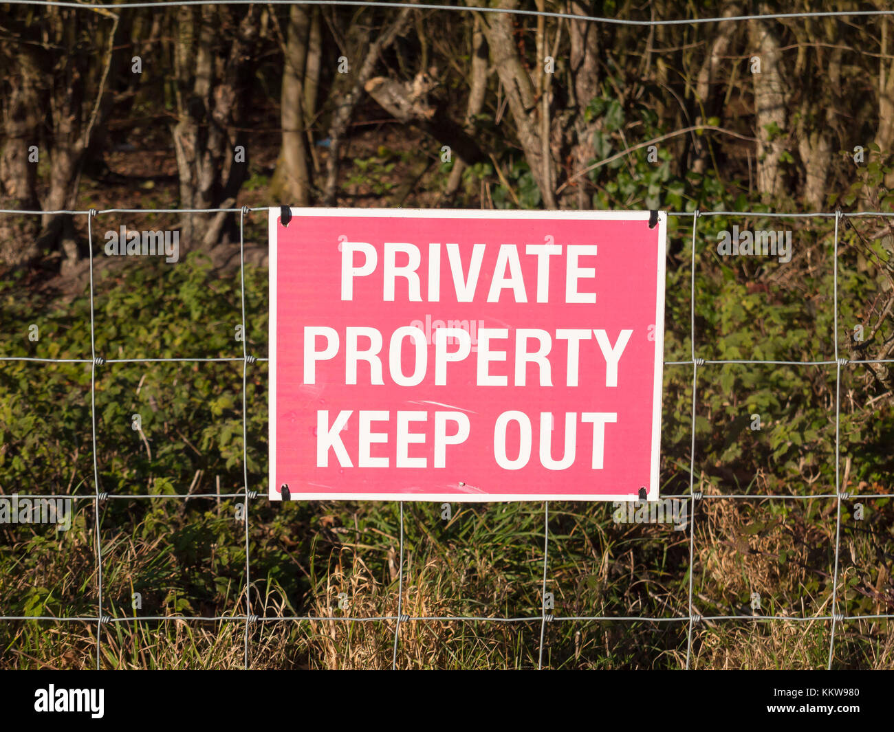 close up of red and white country sign private property keep out; essex ...