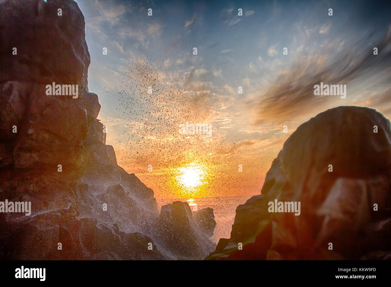 super bright storm at sunset provided sharp rocks of ocean. water ...