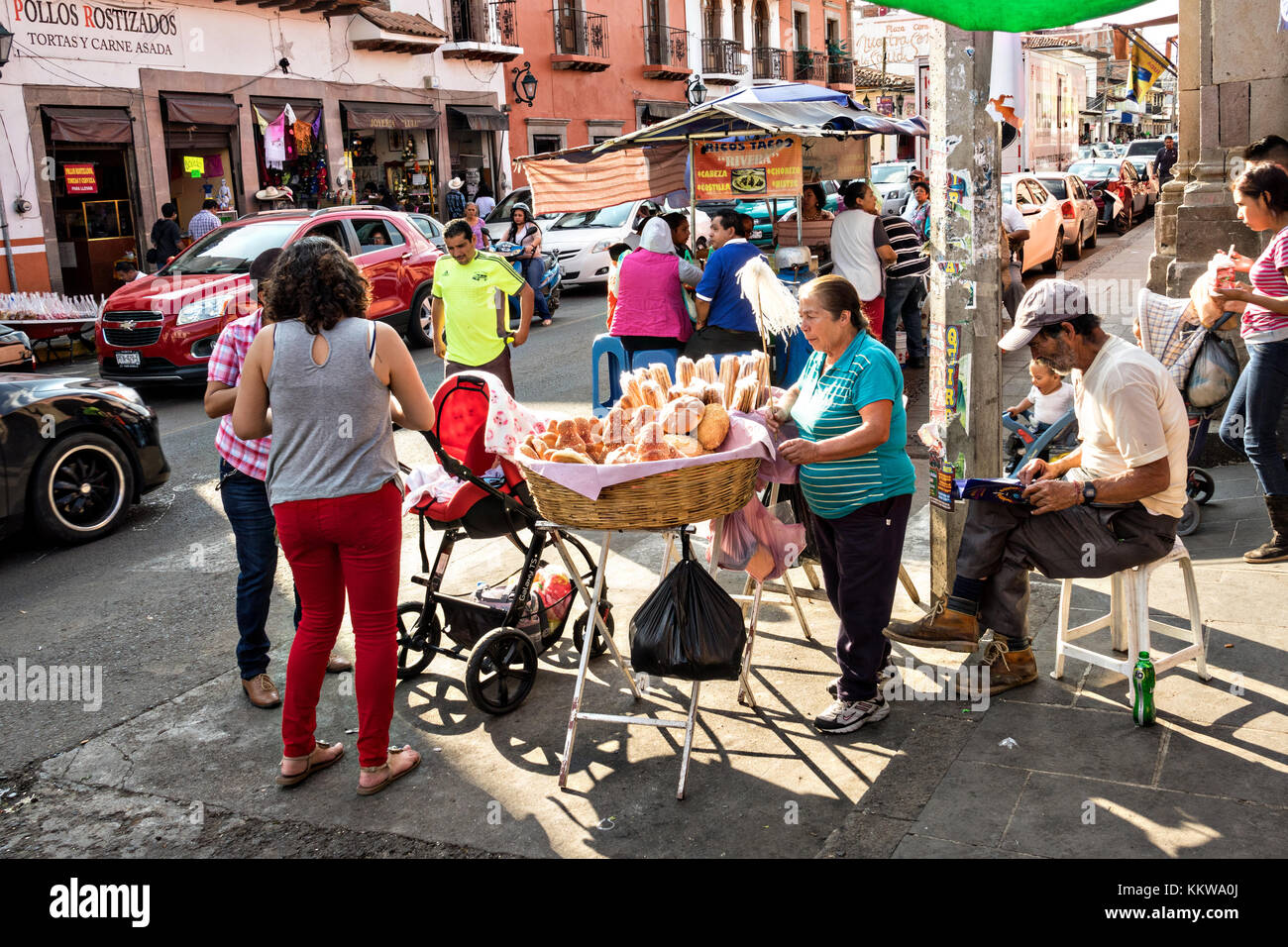 A Mexican woman selling bread along the road in Quiroga, Michoacan ...