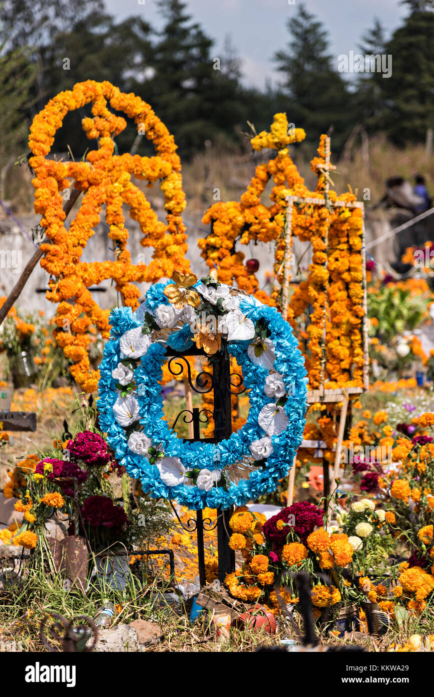 Wreaths and marigold altars decorate tombs during the Day of the Dead ...