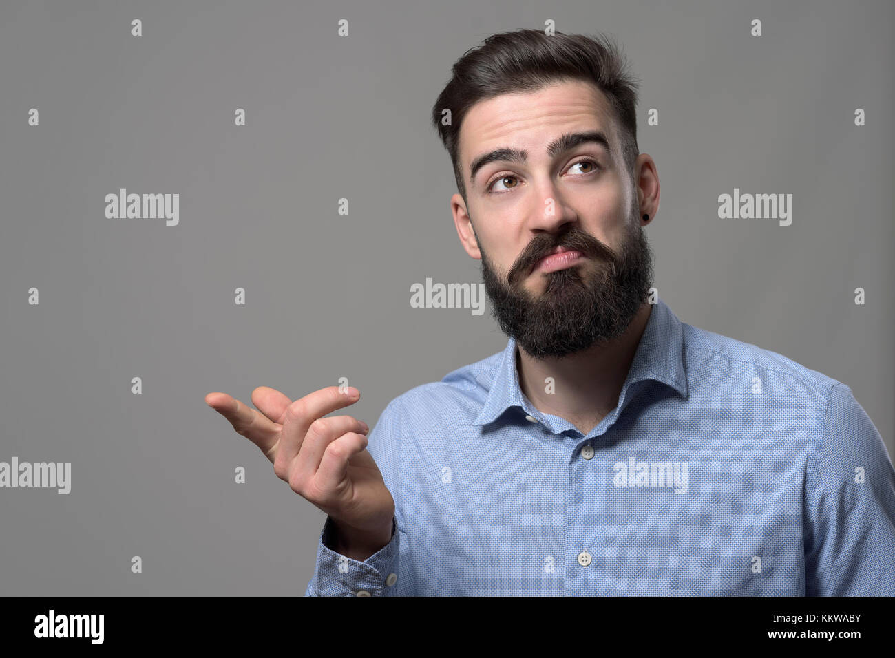 Young bearded smart casual business man with not bad facial approval ...