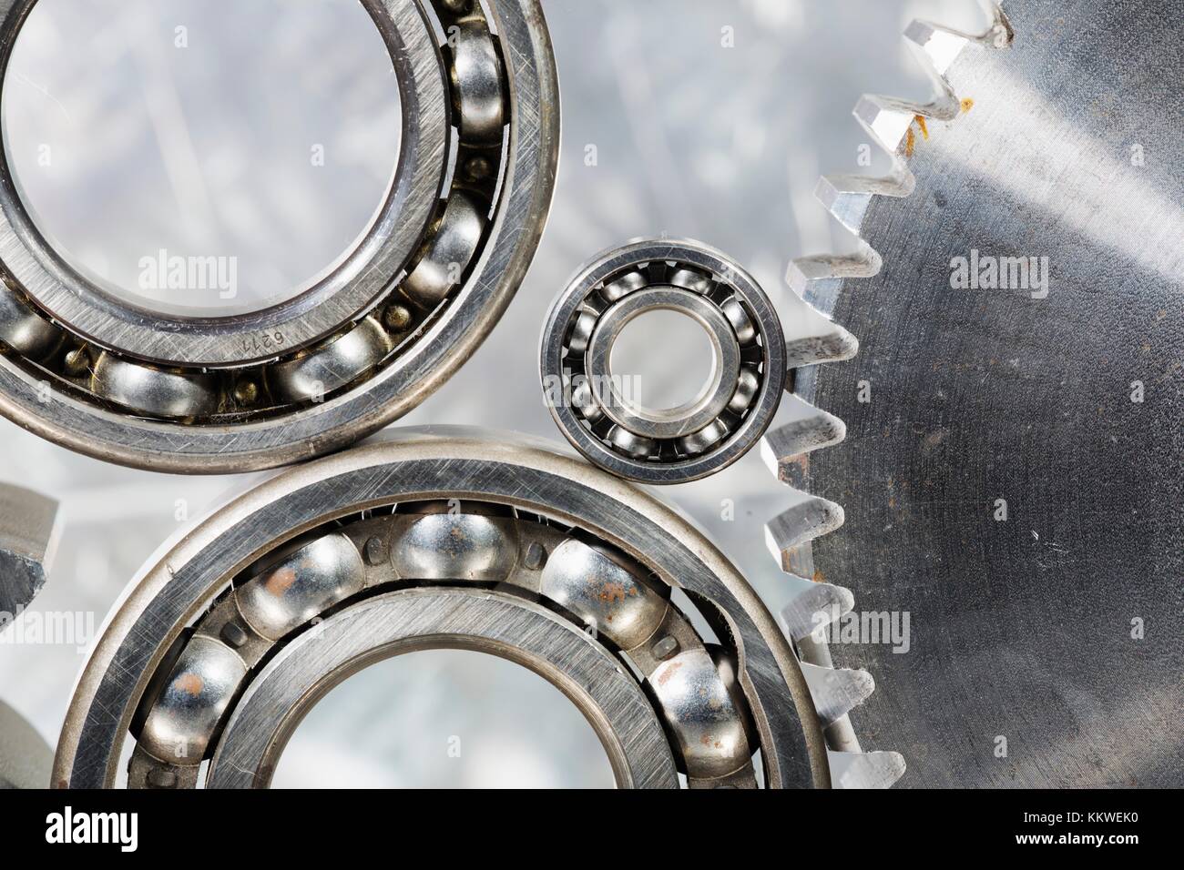 Large steel gears with a small titanium ball-bearings Stock Photo - Alamy