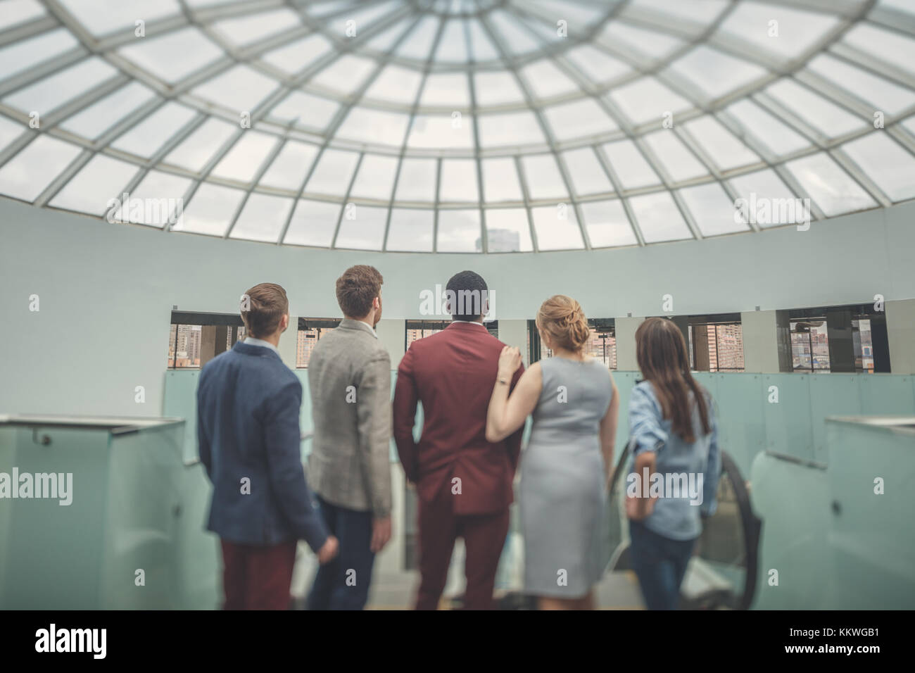 Business people from the back - looking at something Stock Photo - Alamy