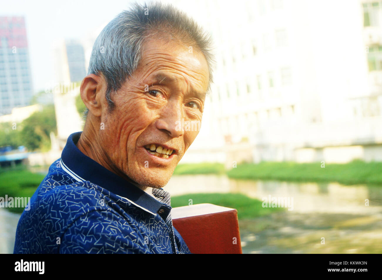 An 80-year-old Chinese man, playing outdoors Stock Photo - Alamy