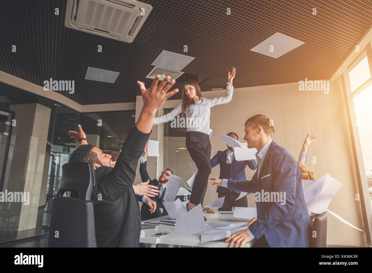 Business team celebrating a triumph with arms up Stock Photo - Alamy