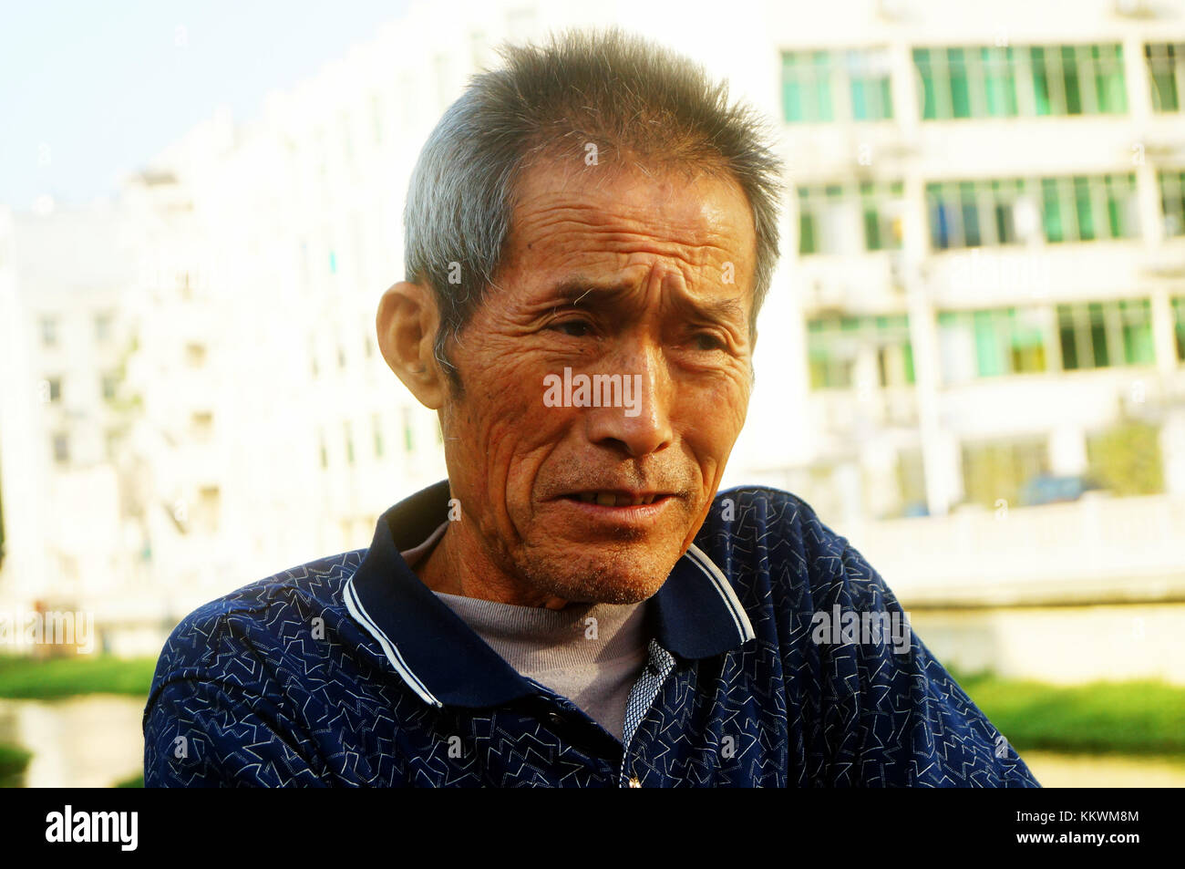 An 80-year-old Chinese man, playing outdoors Stock Photo - Alamy