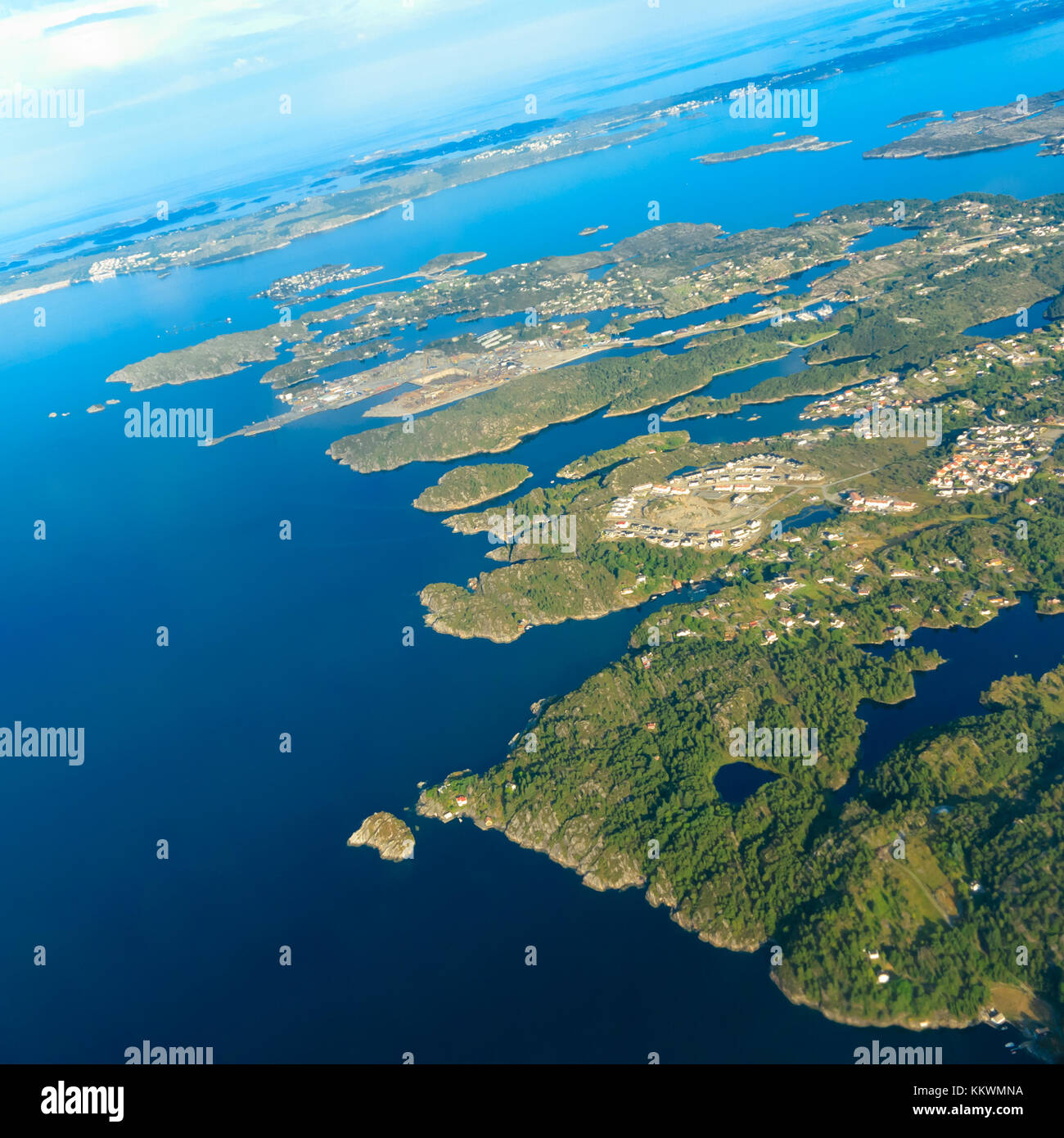 Birds eye. View from window of plane airplane flying over fjords Norway ...