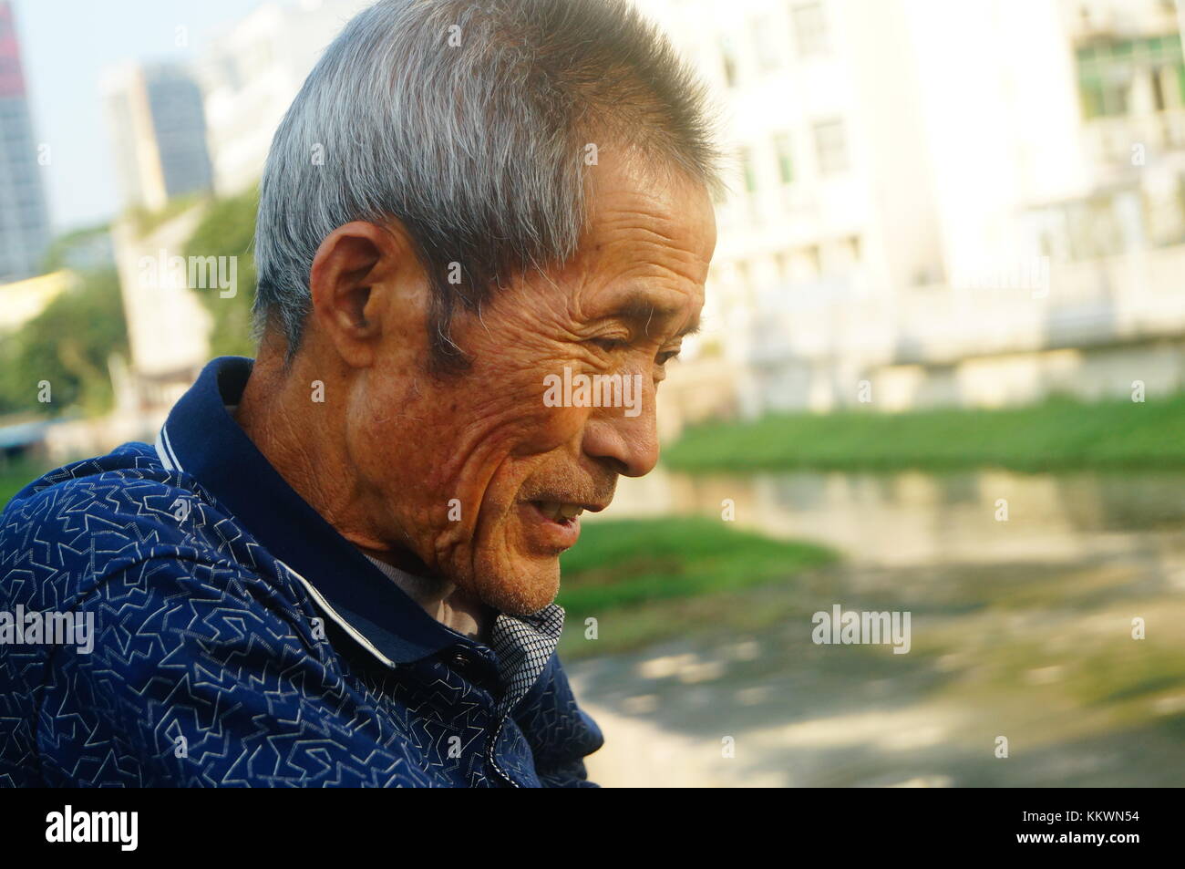 An 80-year-old Chinese man, playing outdoors Stock Photo - Alamy
