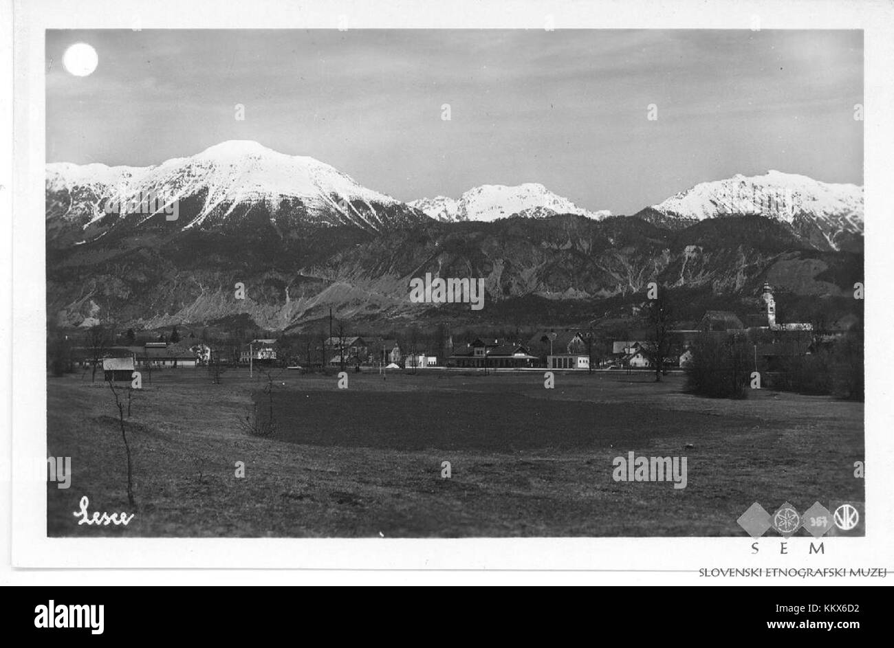 This postcard depicts Lesce, a town in Slovenia, capturing its scenic ...