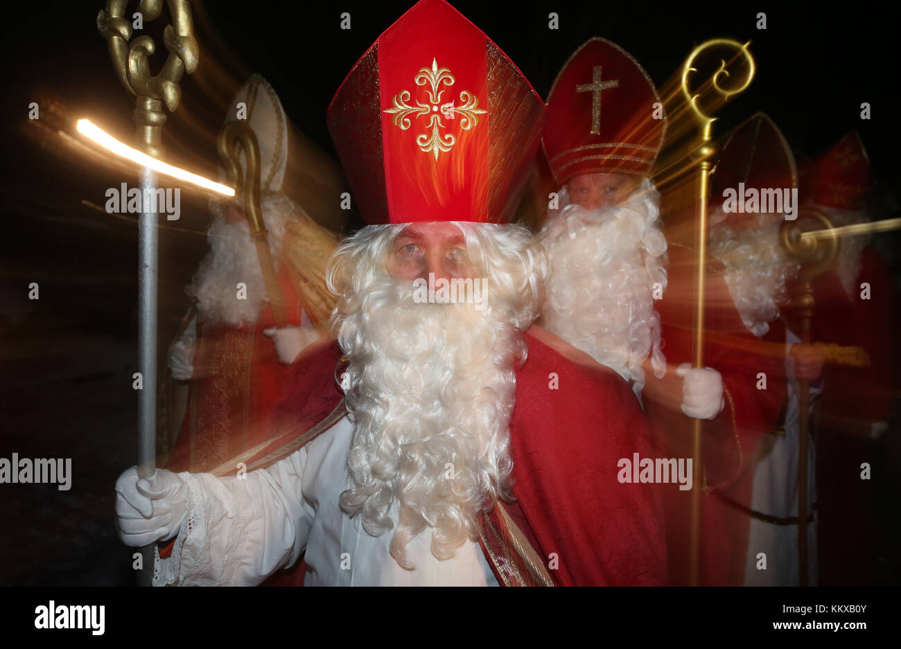 Santa Claus impersonators head towards the parish church Saint Martin ...